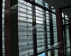 Building Facade with Motorized Aluminum Louvers & HPL Cladding - Glasscon